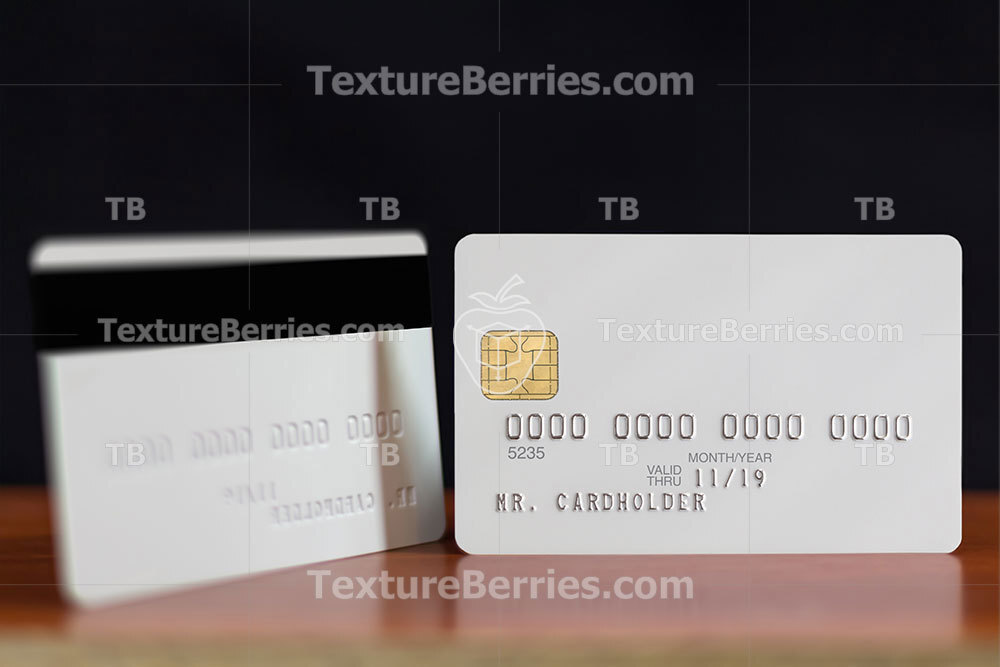 Two sides of blank white credit card with embossing