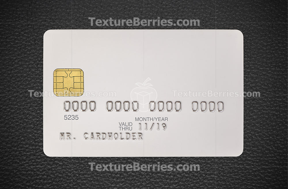 White blank credit card on black leather background