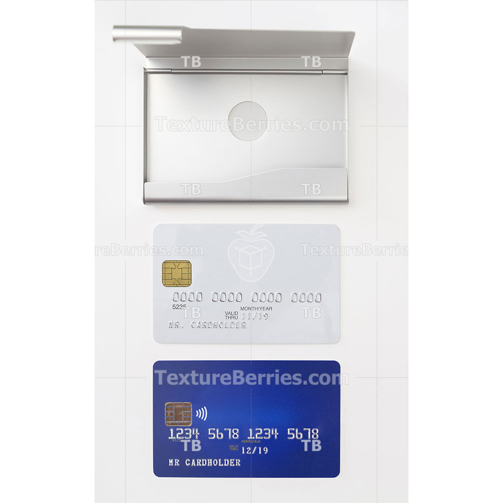 Blank blue and white credit cards and metal business card holder
