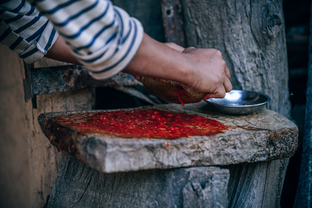 Woman Making Chutney on a Stone Board (6000 x 4000px)