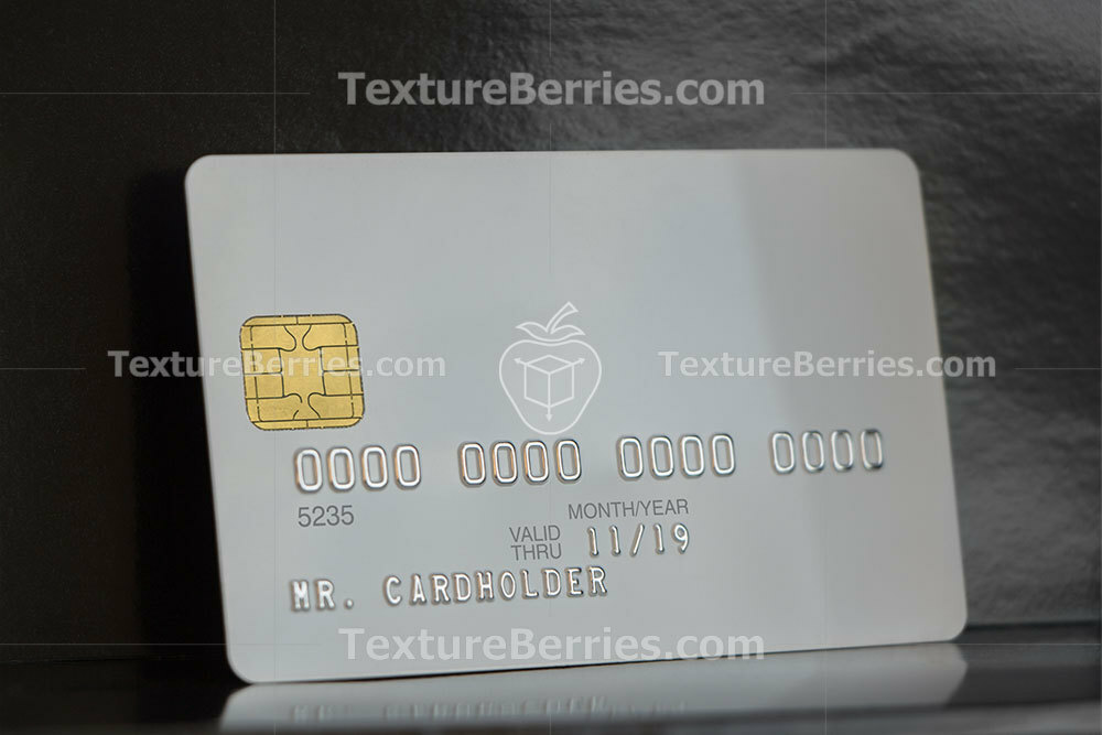 White bank card on dark background