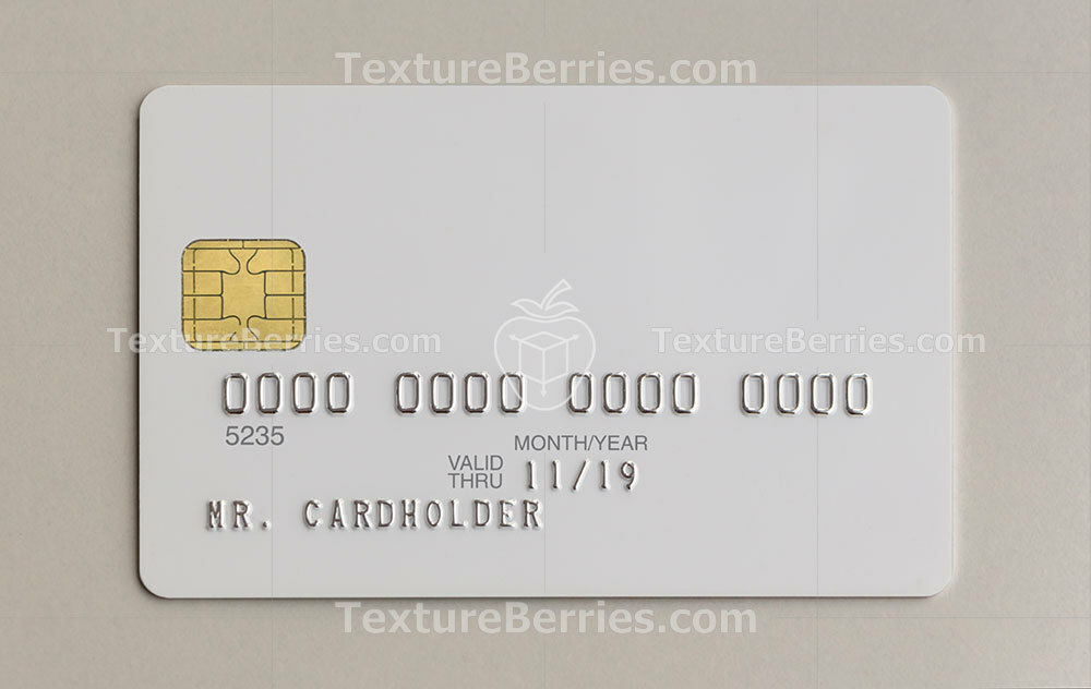 Blank white bank card on paper background