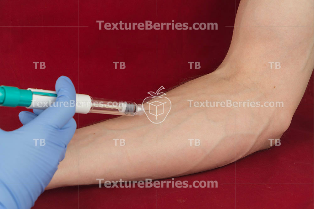 Nurse making injection into a vein
