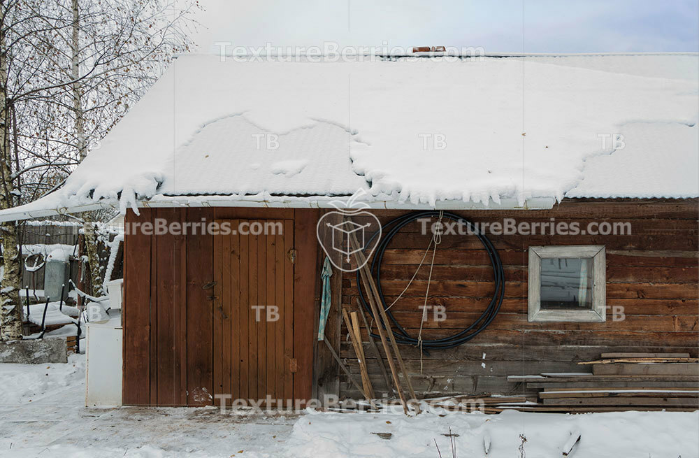 Traditional wooden rustic barn in winter, closeup
