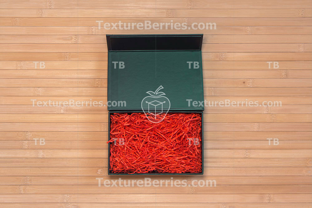 Black box with red filler on bamboo, top view