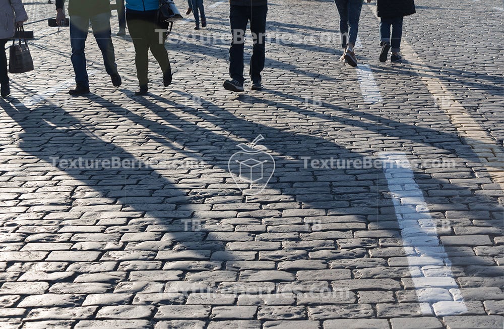 Pedestrians on cobblestone pavement, people traffic, city concept